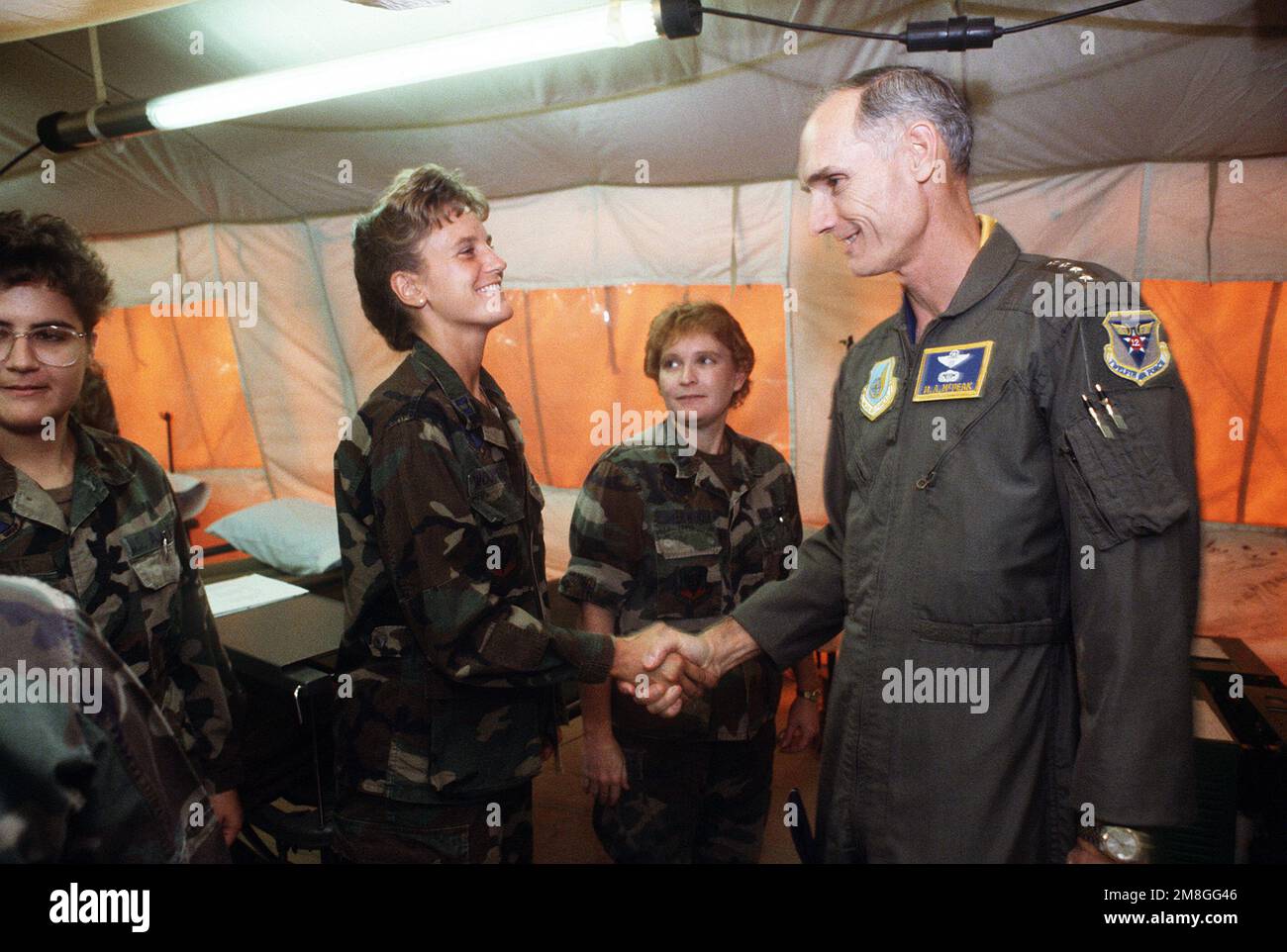 U.S. Air Force CHIEF of STAFF GEN. Merrill A. McPeak greets nurses at ...