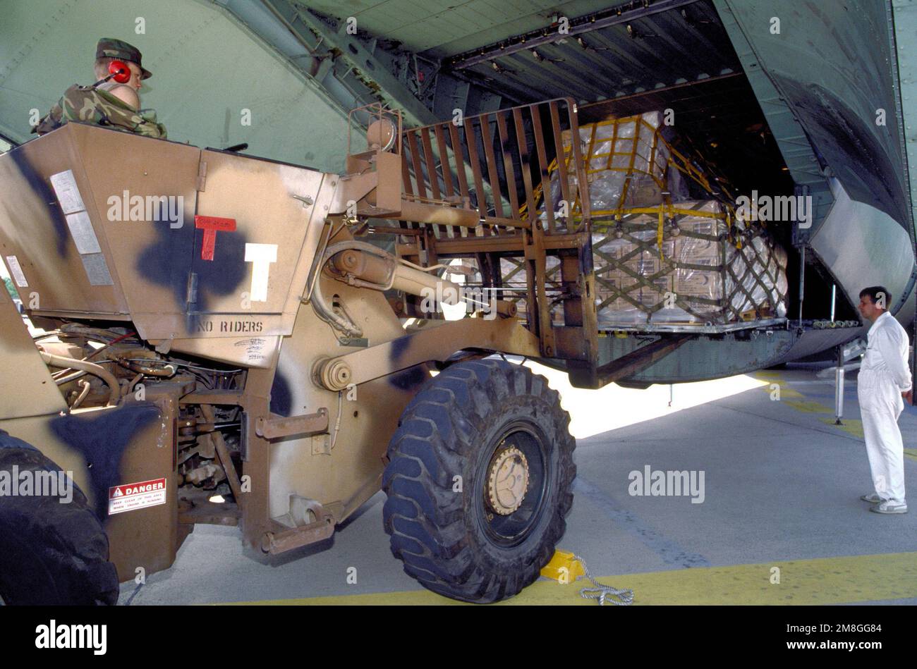 A crew member of the 4th Mobile Aerial Port Squadron uses an M-13K ...
