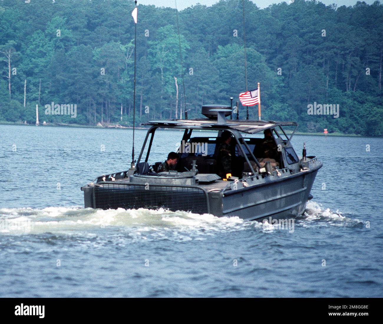 U.S. Marine Corps riverine assault craft RAC-55 patrols an inlet during ...
