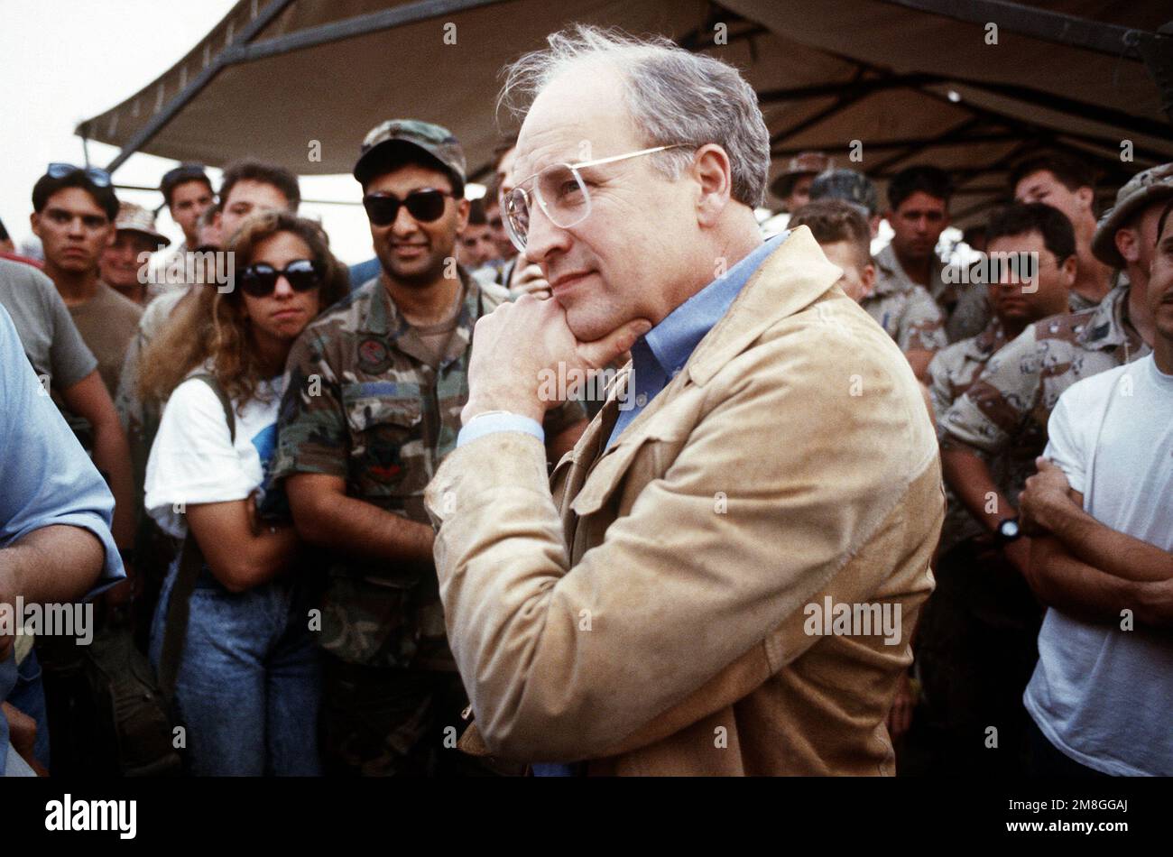 Secretary of Defense Richard Cheney listens to troops during a visit to ...