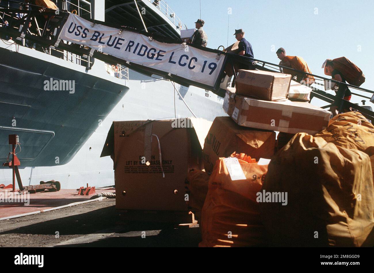 Marines deliver mail for crew members aboard the amphibious command ...