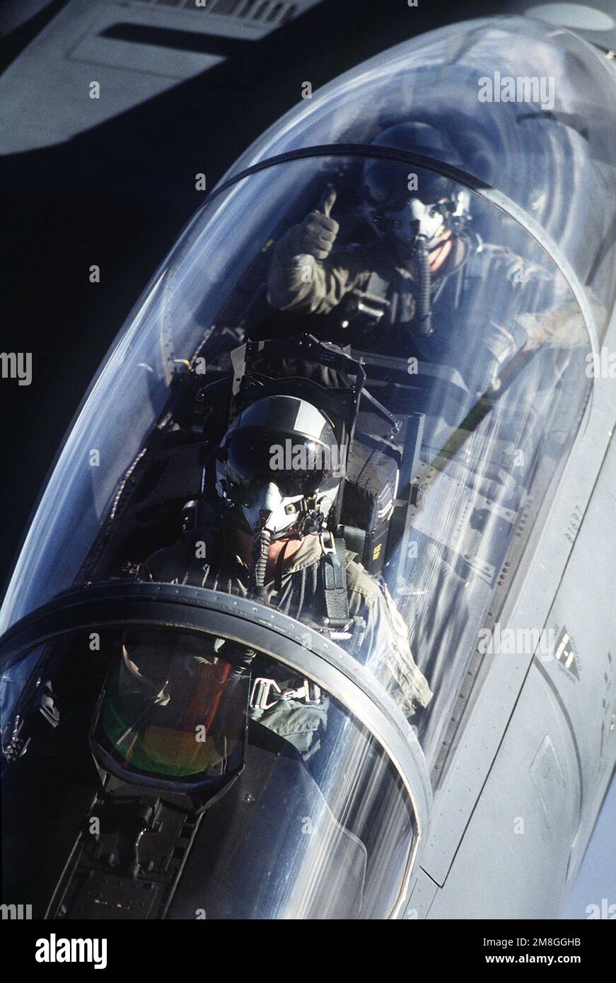 A view of the pilot and co-pilot in the cockpit of a 4th Tactical ...