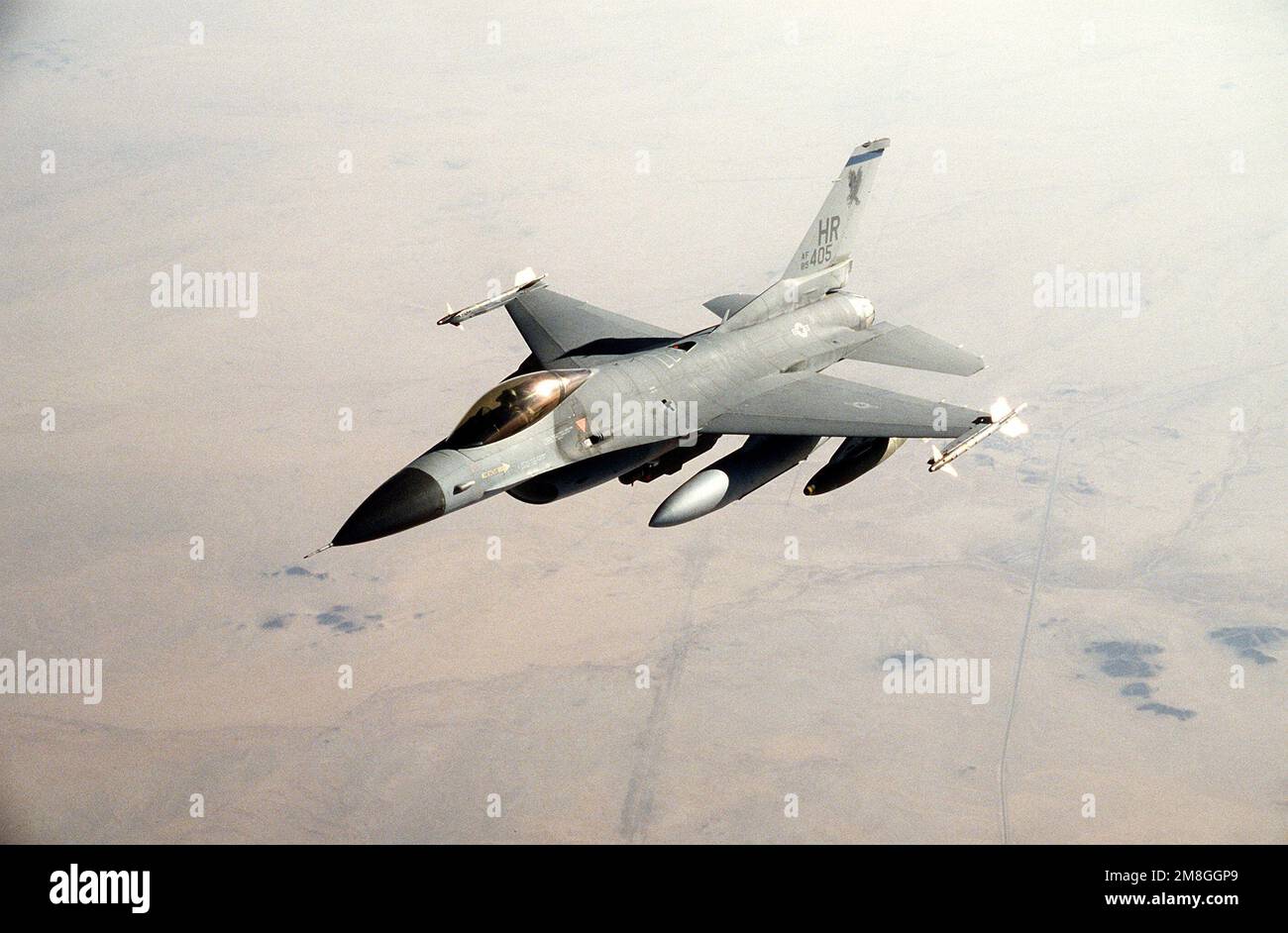 An air-to-air view of an F-16C Fighting Falcon fighter aircraft from ...