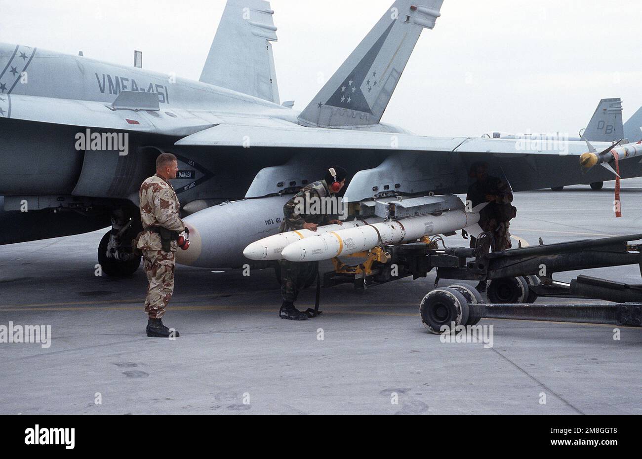U.S. Marines load AGM-88A high-speed anti-radiation missiles under the ...