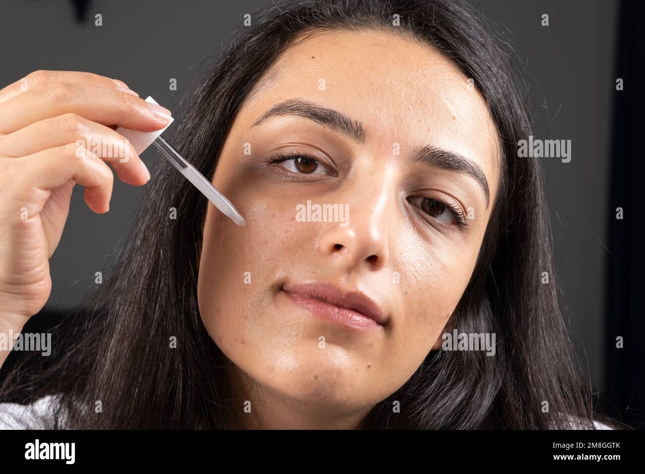 Woman serum face applying hi-res stock photography and images - Alamy