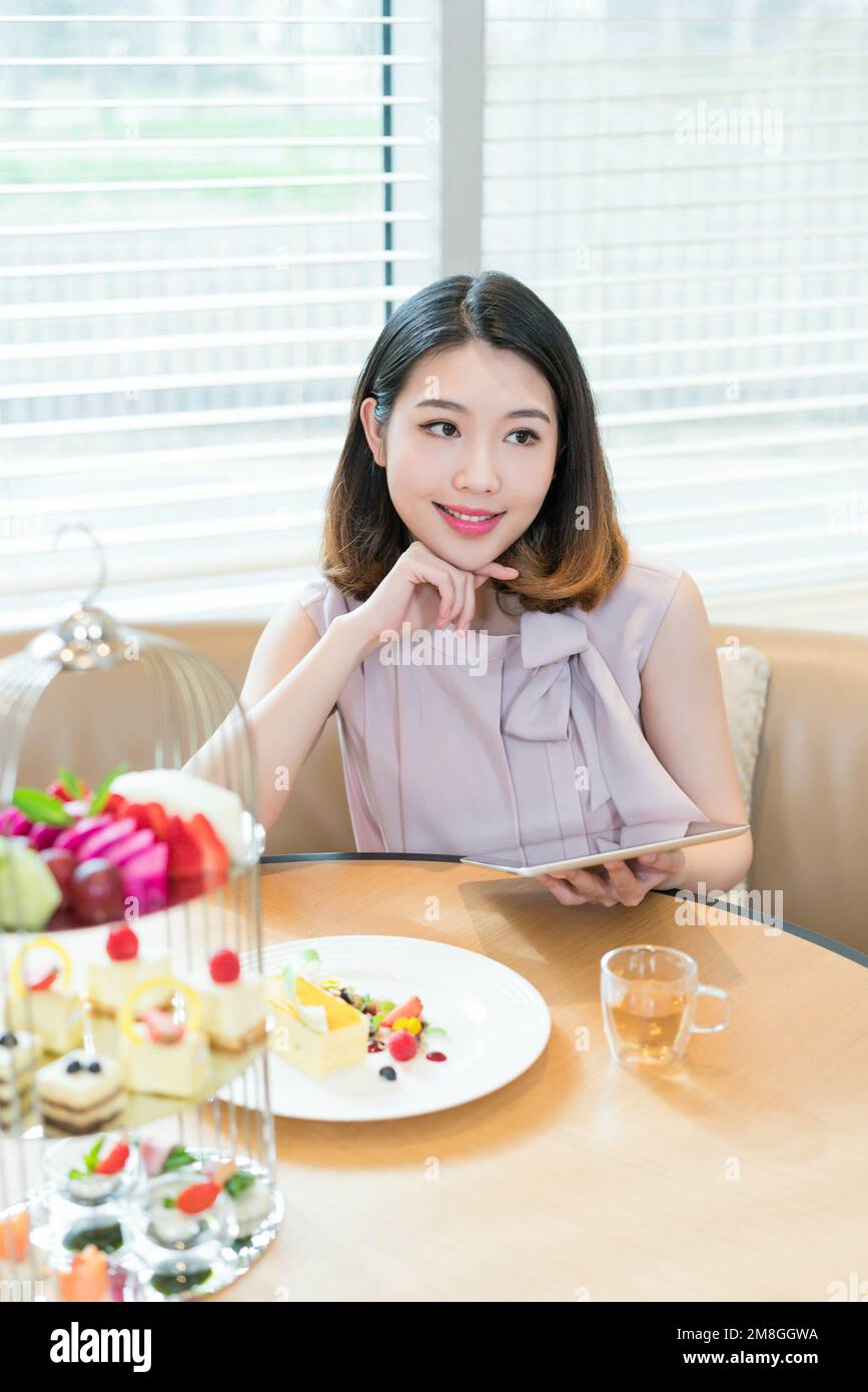 Young woman's afternoon tea time Stock Photo - Alamy