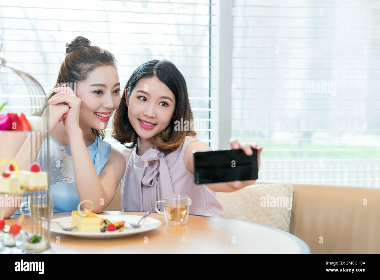 Young woman's afternoon tea time Stock Photo - Alamy