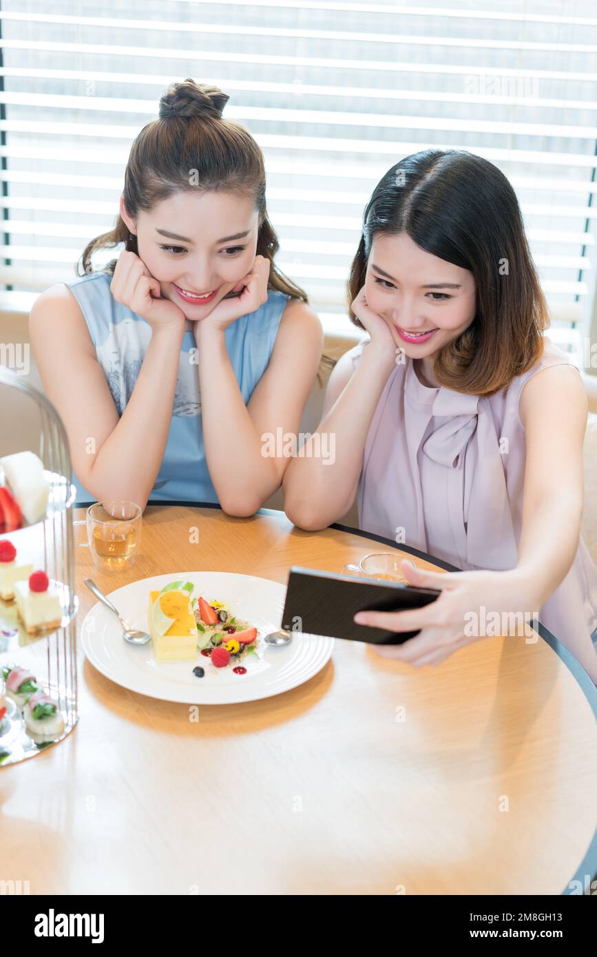 Young woman's afternoon tea time Stock Photo - Alamy