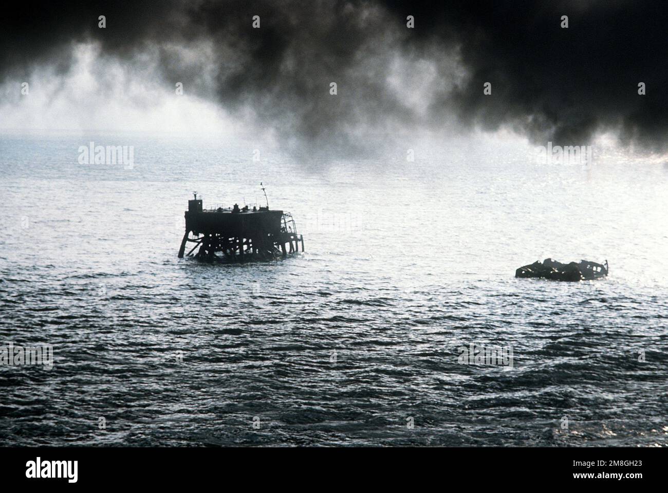 One of the burned platforms of an offshore oil terminal near Kuwait ...