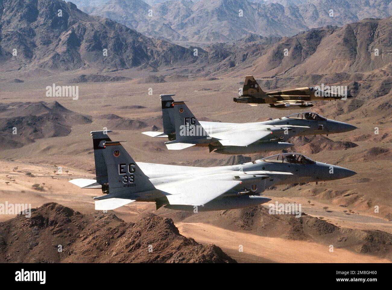 An air-to-air view of two U.S. Air Force F-15C Eagle fighter aircraft ...