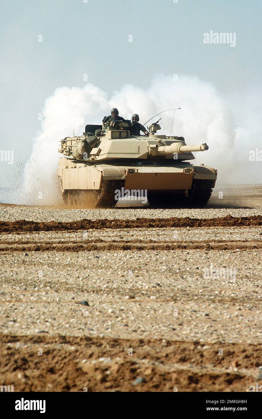 An M-1A1 Abrams main battle tank lays a smoke screen during maneuvers ...
