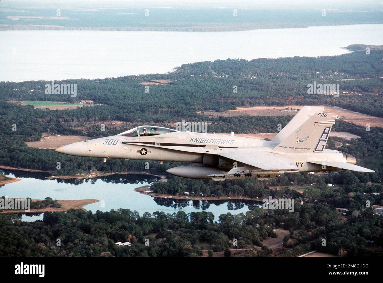 An air-to-air left side view of the Strike Fighter Squadron 136 (VFA ...