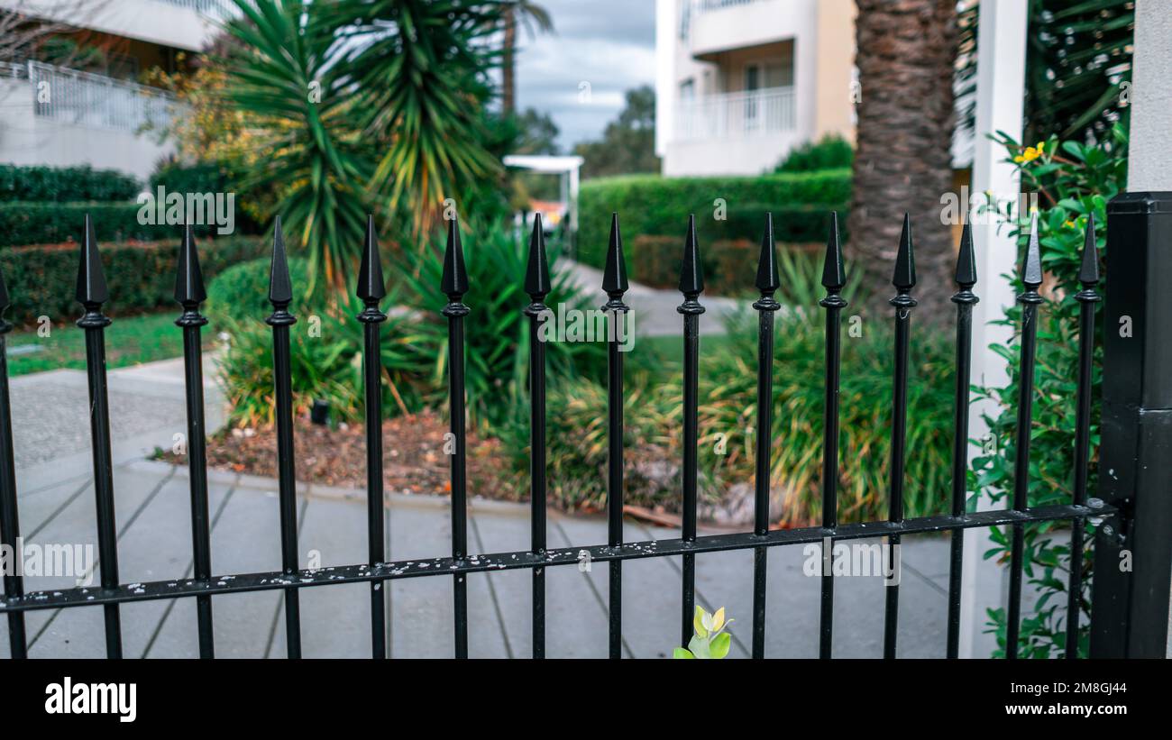 Sharp black gate fence pikes Stock Photo - Alamy