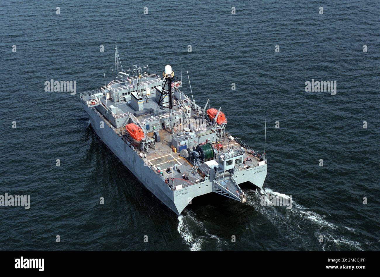 A port quarter view of the ocean surveillance ship USNS VICTORIOUS (T ...