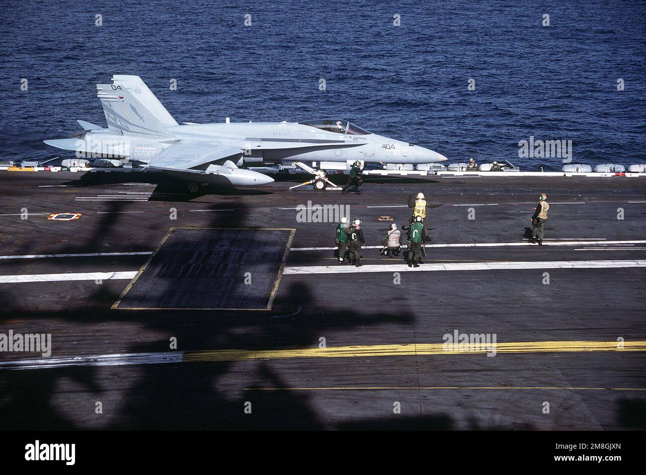 A Strike Fighter Squadron 147 (VFA-147) F/A-18C Hornet aircraft is launched from the flight deck ...