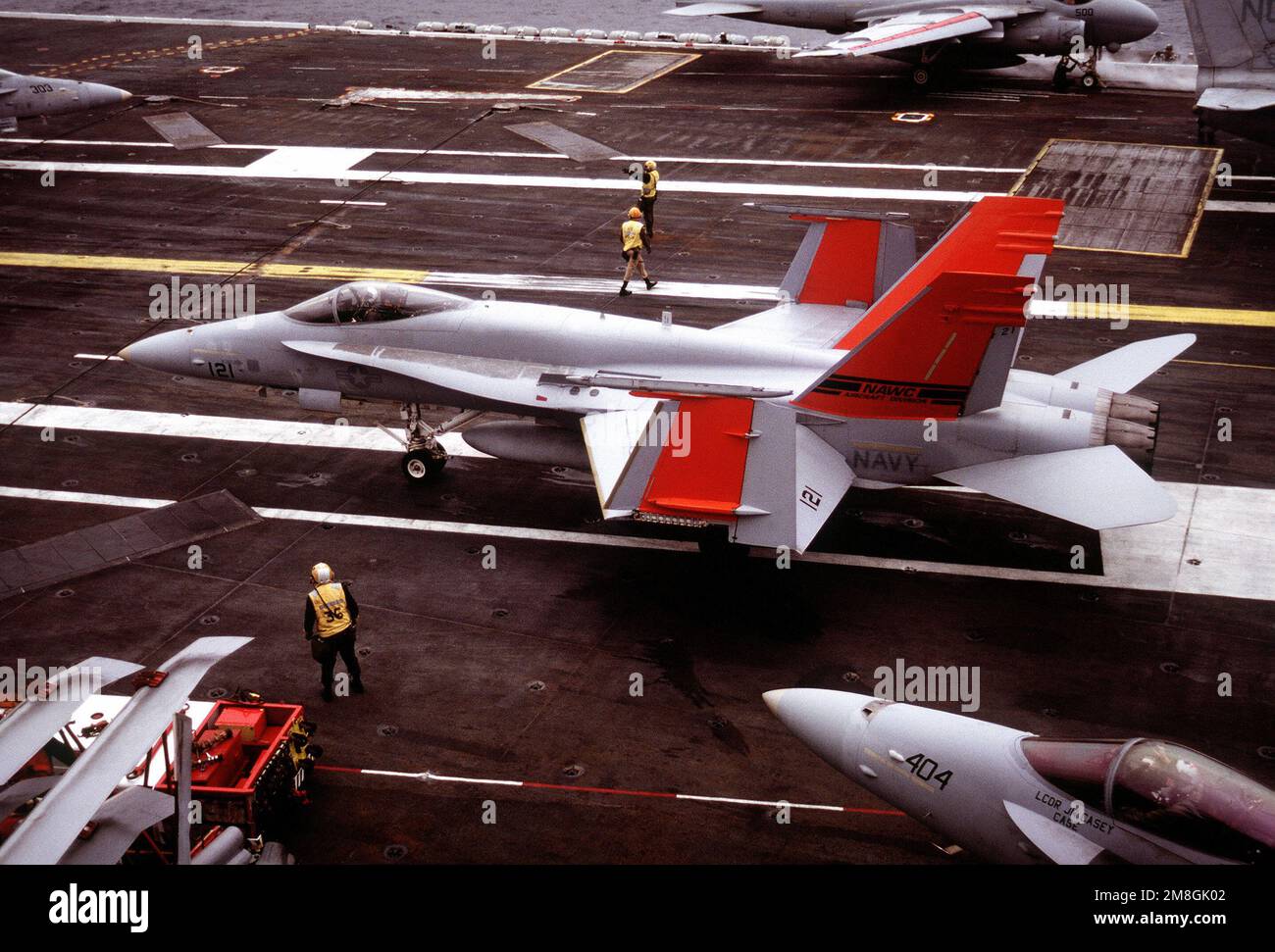 An F/A-18A Hornet aircraft taxis on the flight deck during flight ...