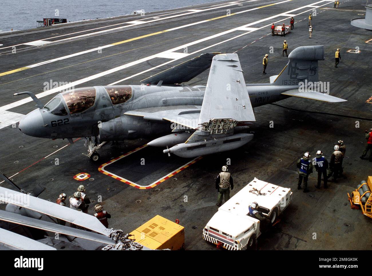 The flight crew of a Tactical Electronic Warfare Squadron 138 (VAQ-138) EA-6B Prowler aircraft ...