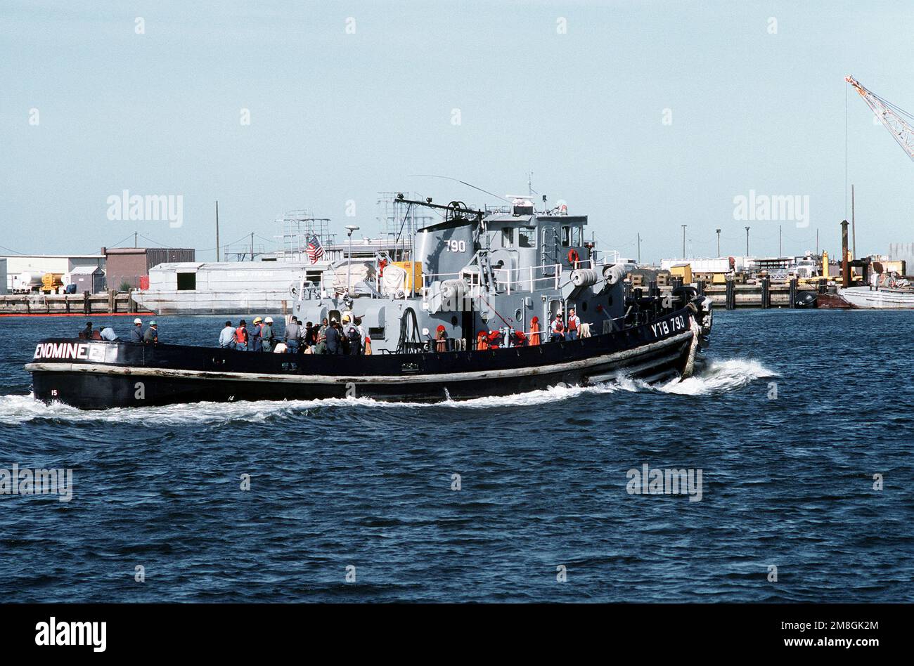 A starboard quarter view of the large harbor tug MENOMINEE (YTB-790 ...