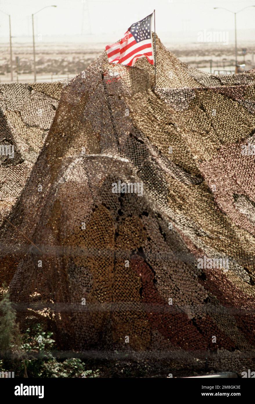 Camouflage netting covers equipment at a U.S. military installation ...