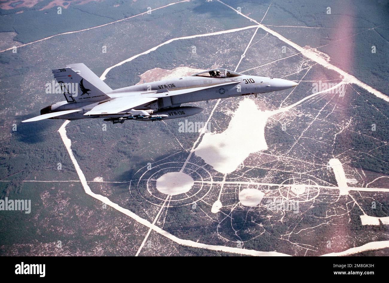 An air-to-air right side view of a Strike Fighter Squadron 136 (VFA-136 ...