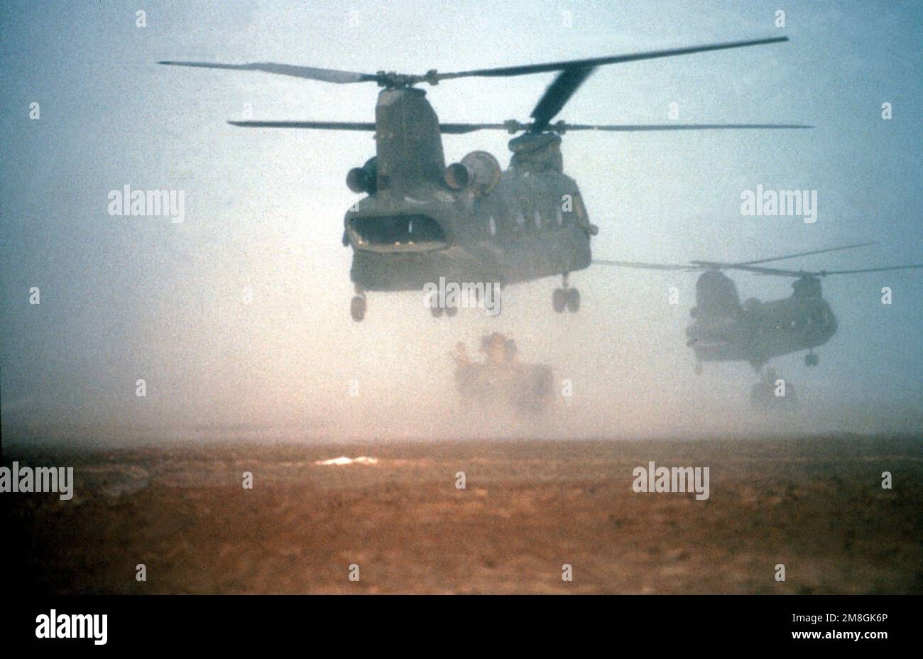 U.S. Army CH-47 Chinook helicopters takeoff on a mission during ...