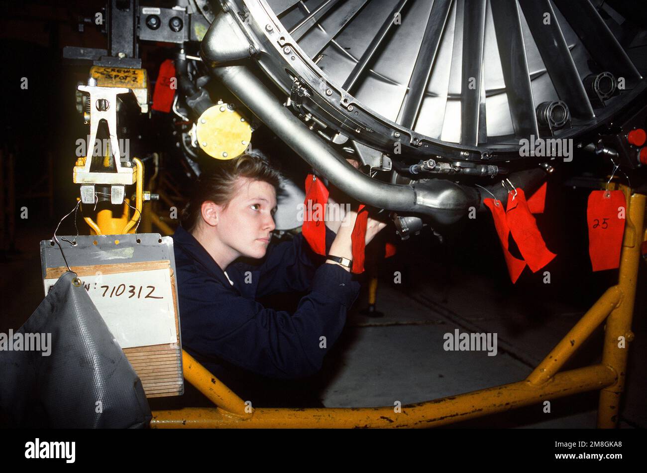 Aviation Machinist's mate AIRMAN J. Roy removes a part from a jet ...