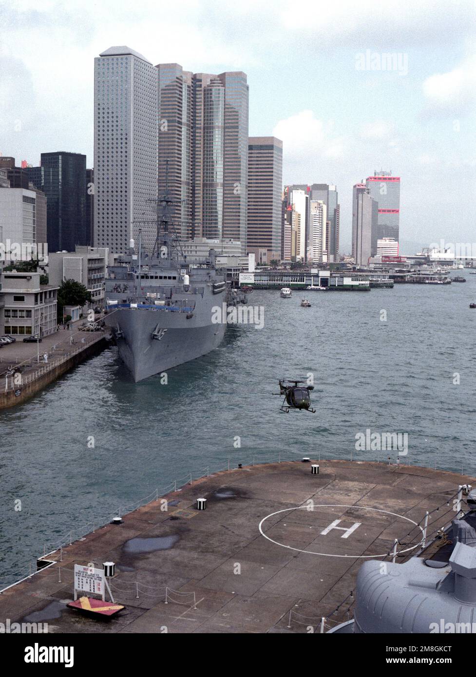 A bow view of the amphibious transport dock USS OGDEN (LPD-5) moored to ...