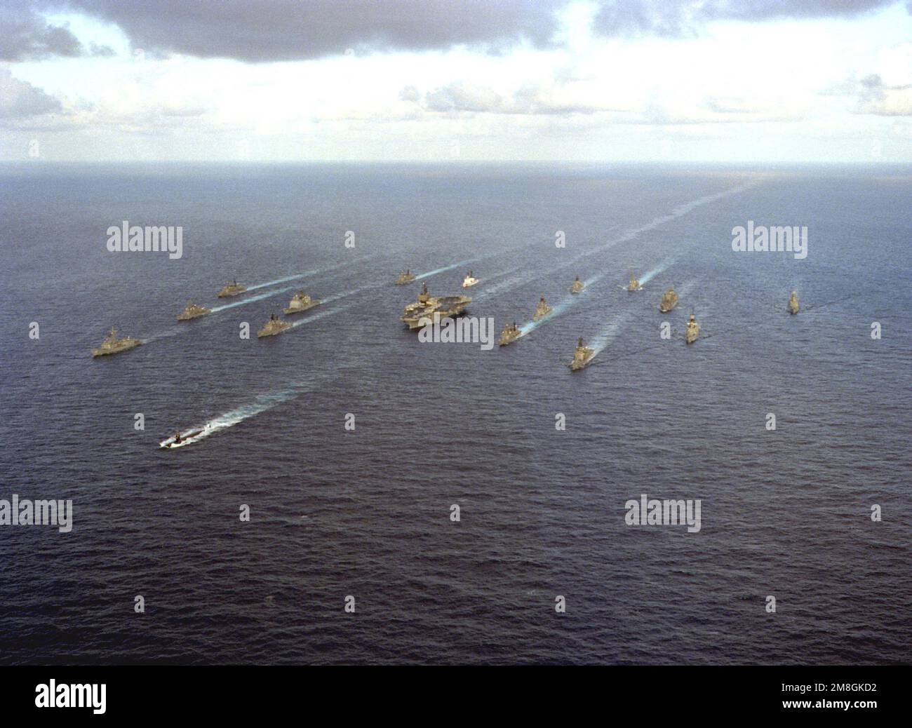 An aerial view of the aircraft carrier USS KITTY HAWK (CV-63) and other ...