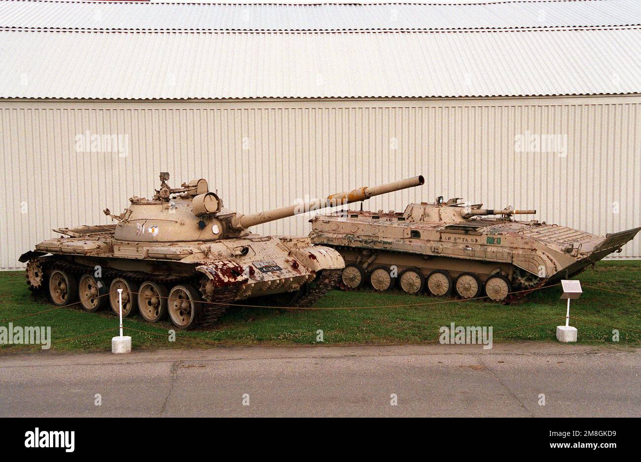 A foreign-built T-62A main battle tank and a BMP-1 infantry fighting ...