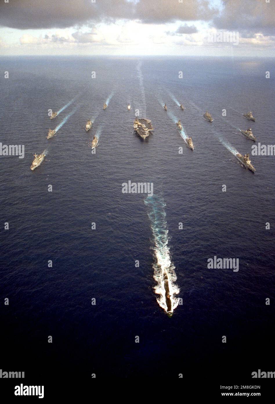 An aerial view of the aircraft carrier USS KITTY HAWK (CV-63) and other ...