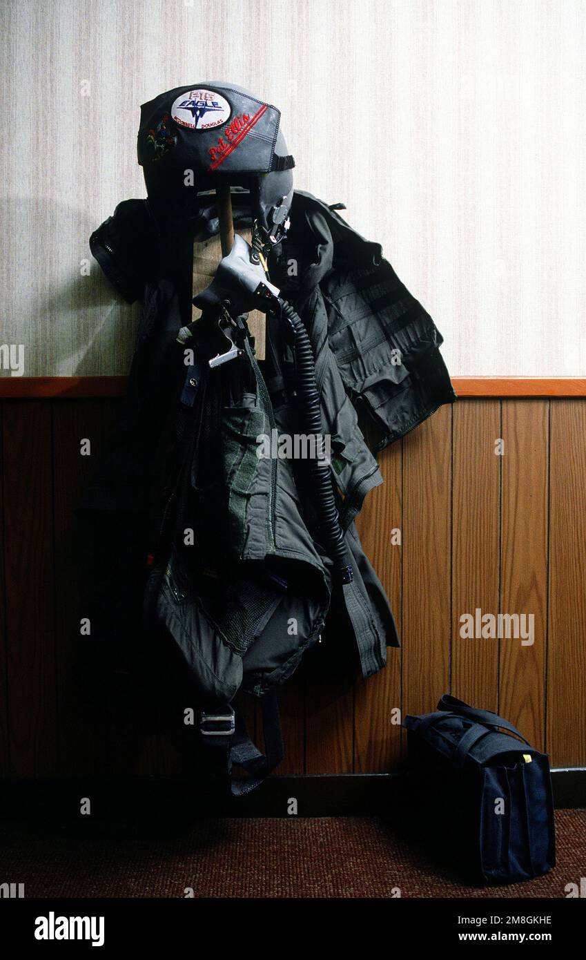 An F-15 Eagle pilot's flight gear hangs up, ready for a mission, at the ...