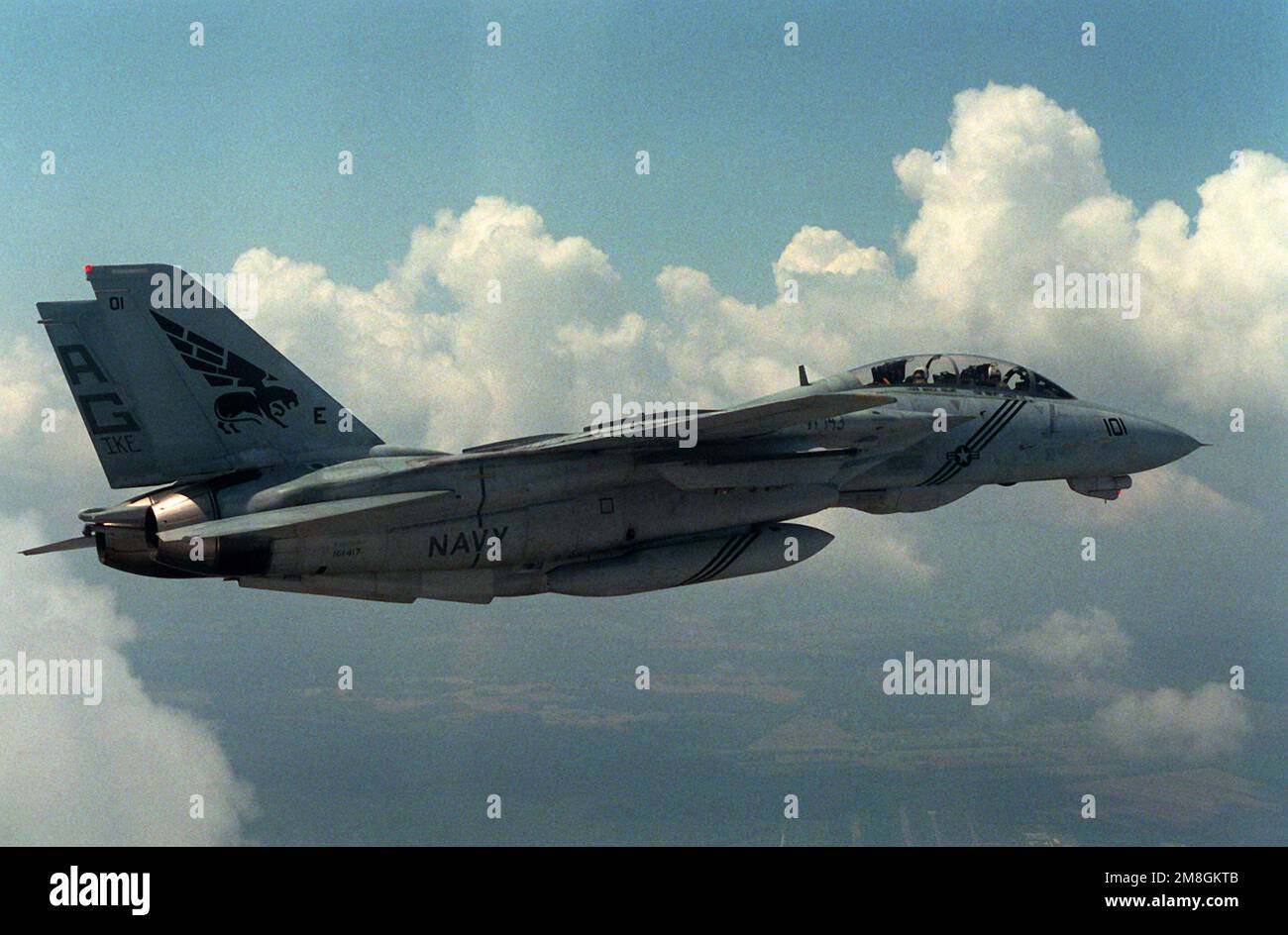 An air-to-air right side view of a Fighter Squadron 143 (VF-143) F-14B ...
