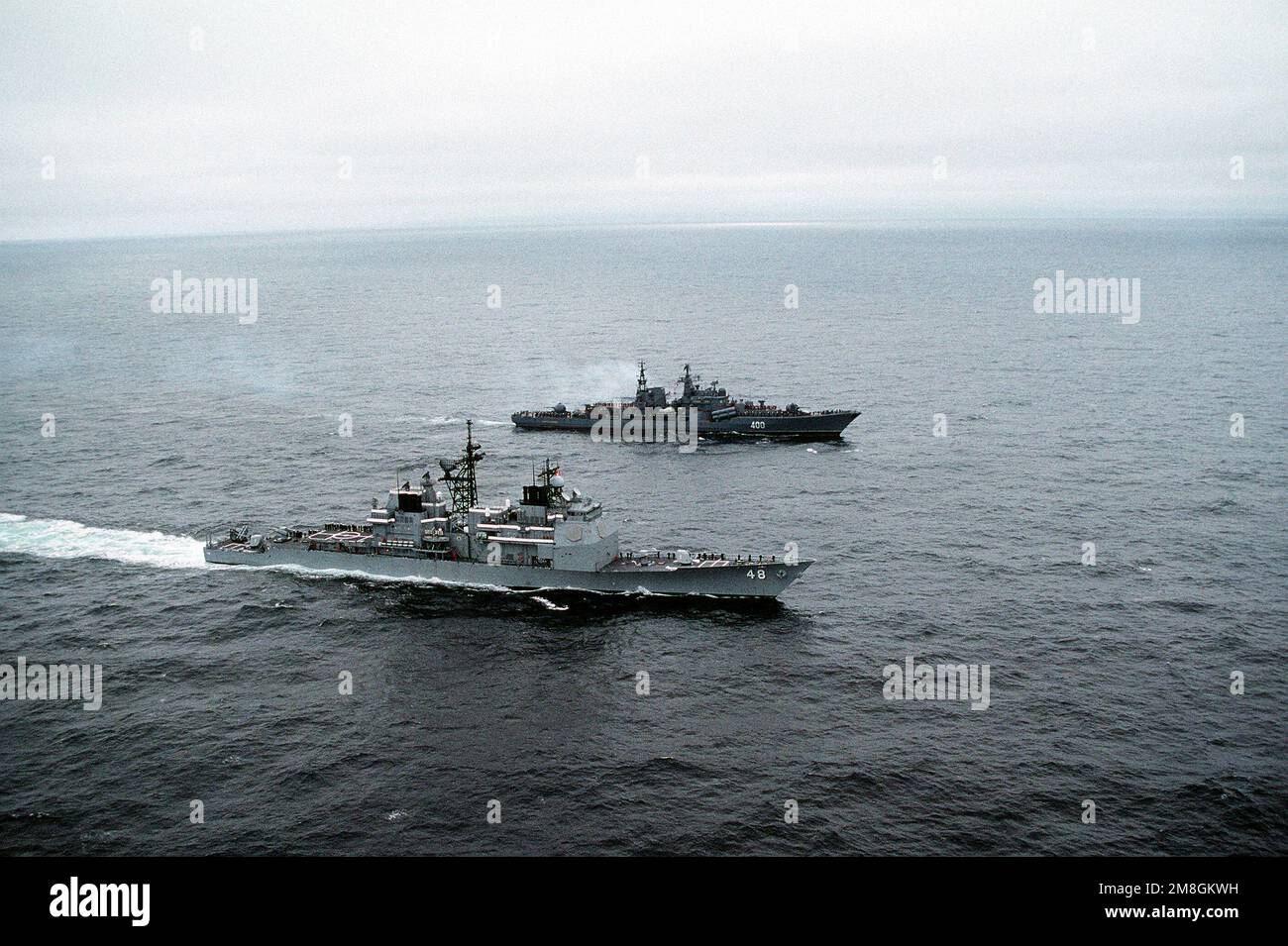 With the crews of both ships manning the rails in the naval tradition ...