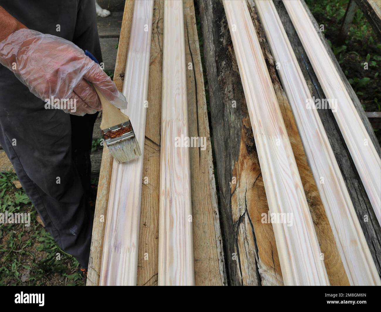 coating long wood slats with translucent white paint to bring out the ...