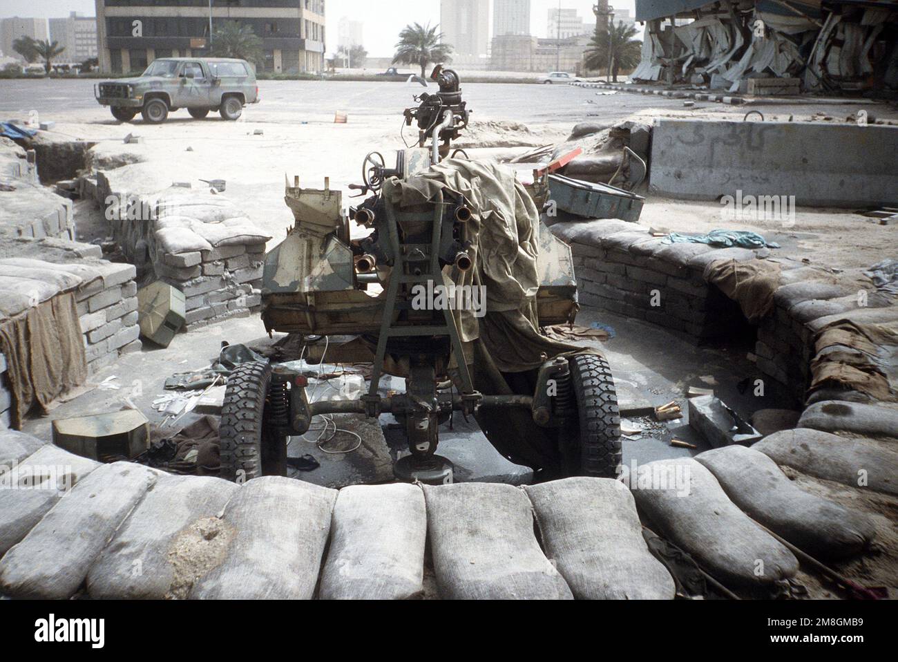 An abandoned Iraqi ZPU-4 anti-aircraft gun remains on the beach in ...