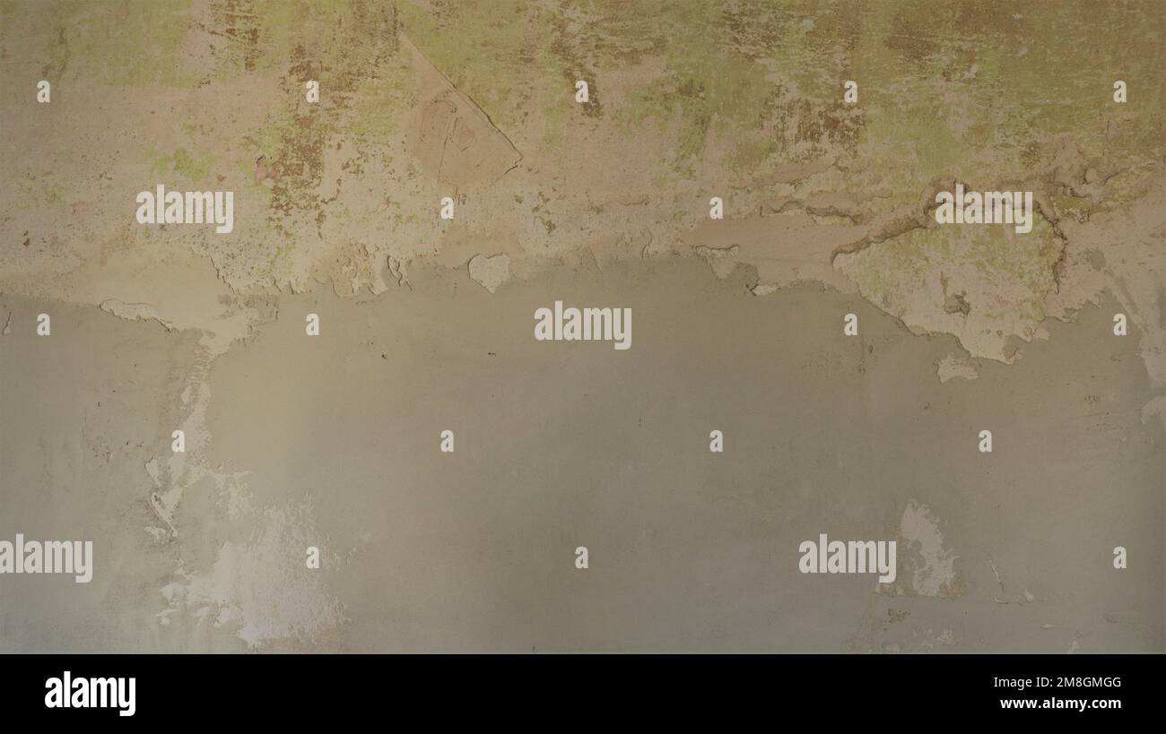 empty texture wall with peeled off remnants of green paint plastered ...