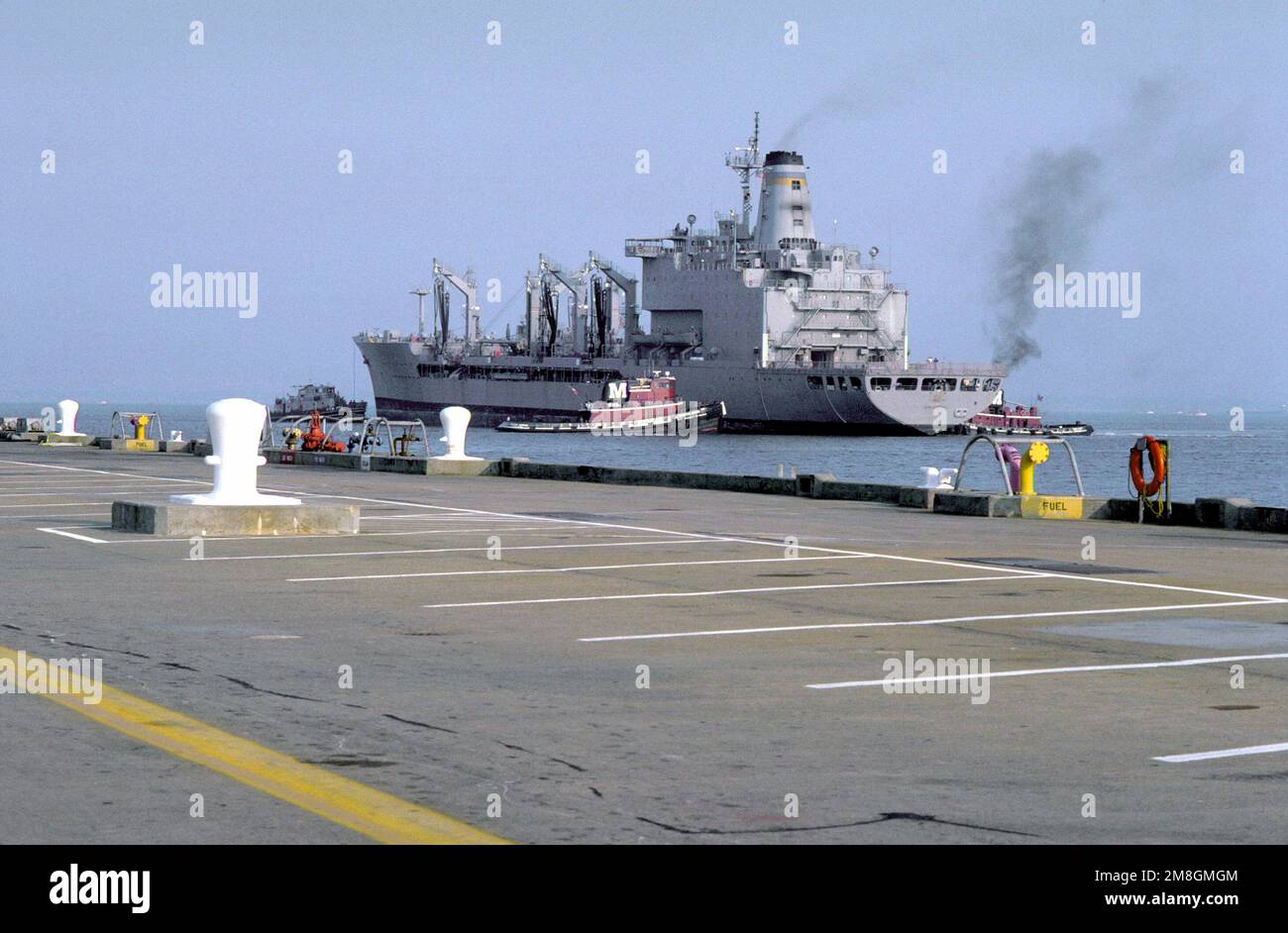 An air-cushion landing craft (LCAC) passes astern of the dock landing ...
