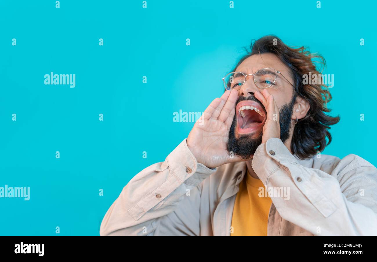 Man shouting loud calling attention with hands like megaphone isolated ...