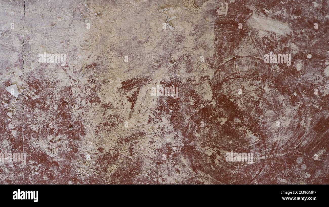 light chalk or stucco chips scattered on a dark wooden floor as a rough ...