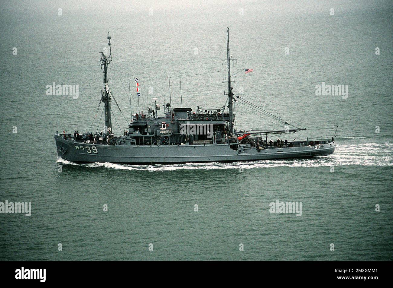 A port beam view of the salvage ship USS CONSERVER (ARS-39) underway ...