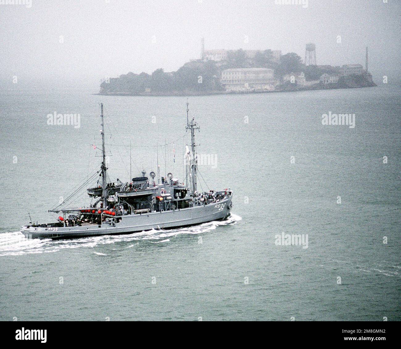 A starboard quarter view of the salvage ship USS CONSERVER (ARS-39) as ...