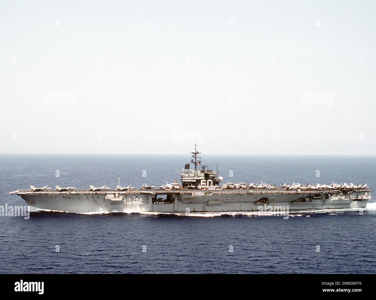 A port beam view of the aircraft carrier USS SARATOGA (CV-60) underway ...