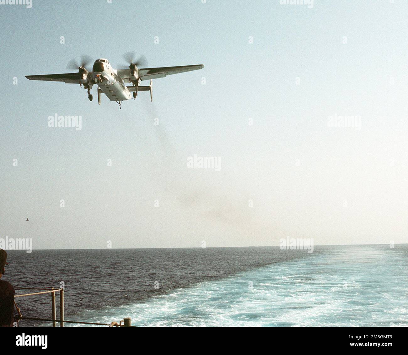 A C-2A Greyhound aircraft approaches the flight deck of the aircraft ...
