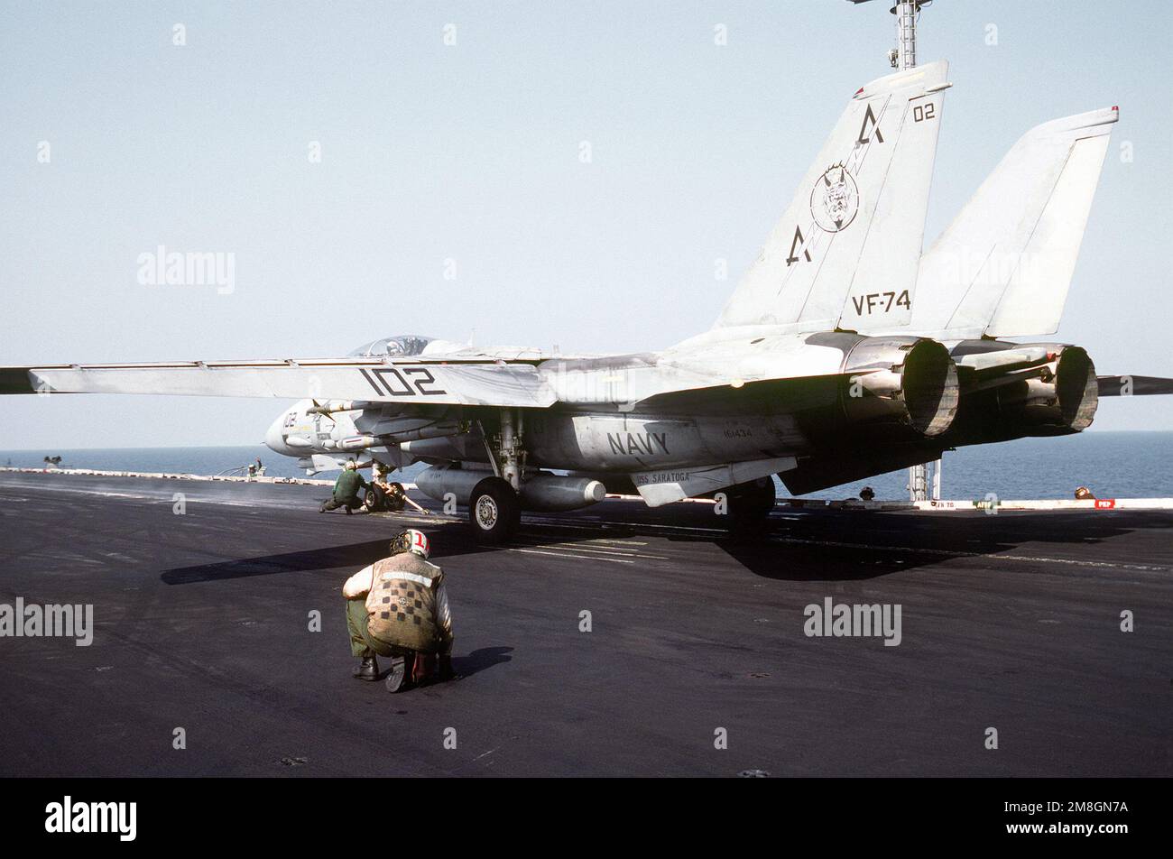 The starboard catapult crew prepares a Fighter Squadron 74 (VF-74) F-14B Tomcat aircraft for ...