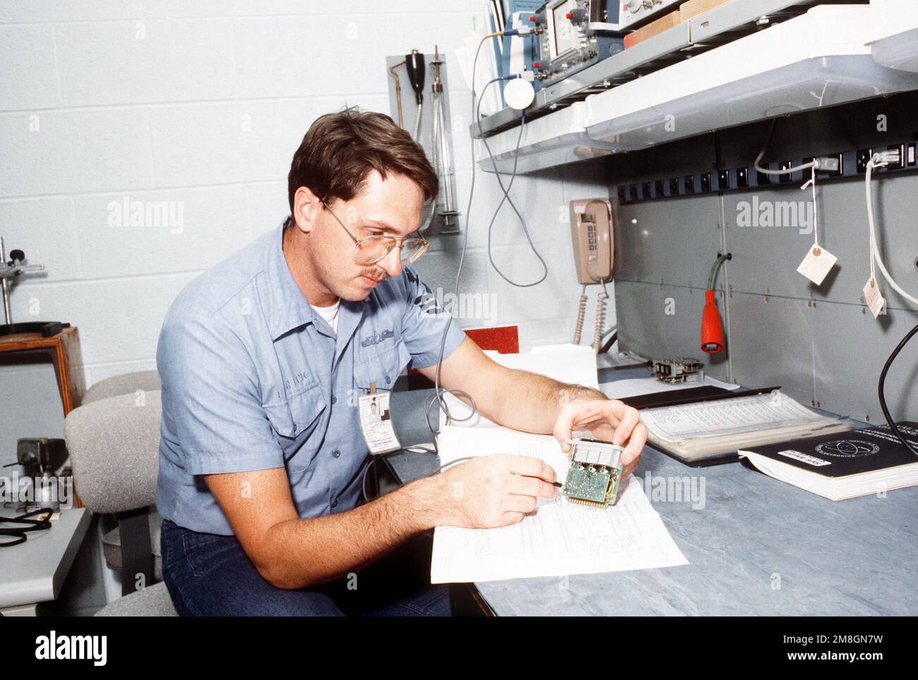 An electronics technician tests equipment. Base: Naval Air Station, Key ...