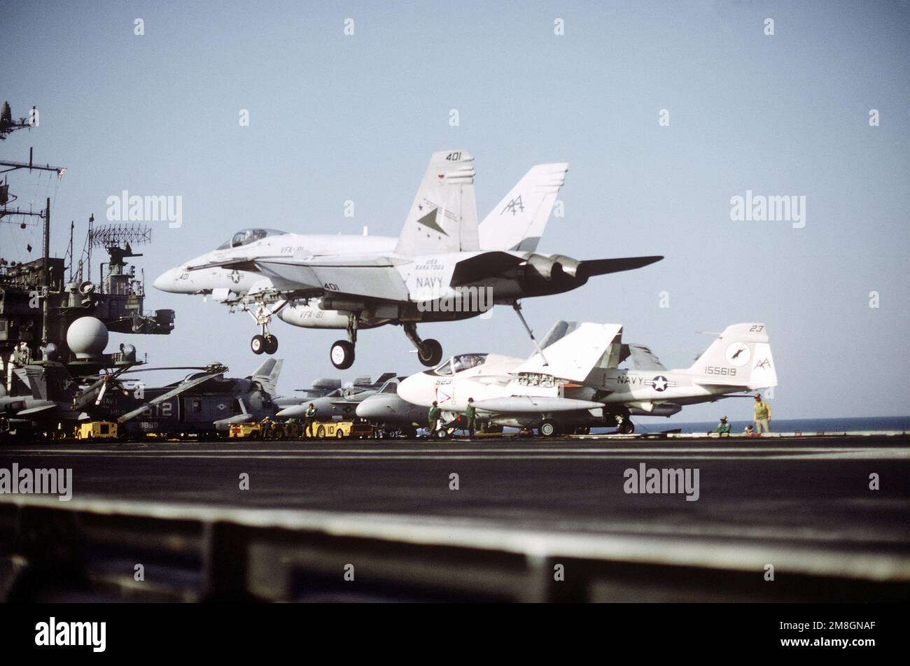 A Strike Fighter Squadron 31 (VFA-81) F/A-18C Hornet aircraft lands on ...
