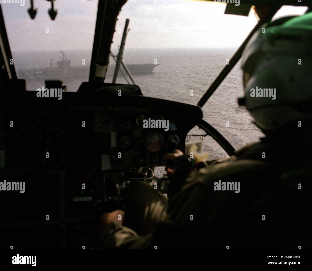 The pilot of a Helicopter Anti-submarine Squadron 85 (HS-85) SH-3H Sea ...