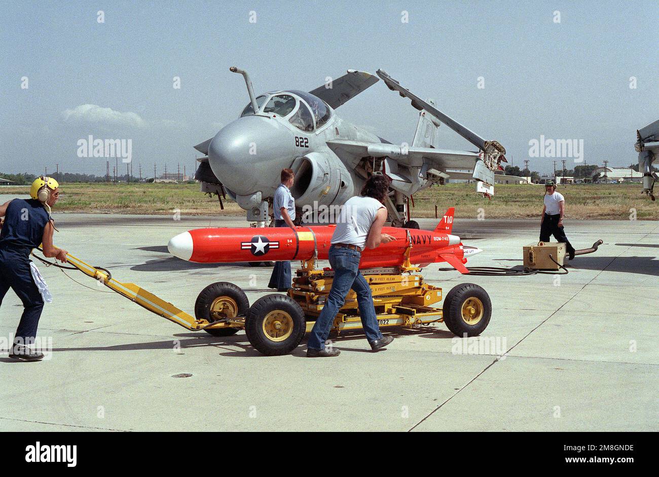 A weapons loader is used to move a BQM-74E target drone to an Attack ...