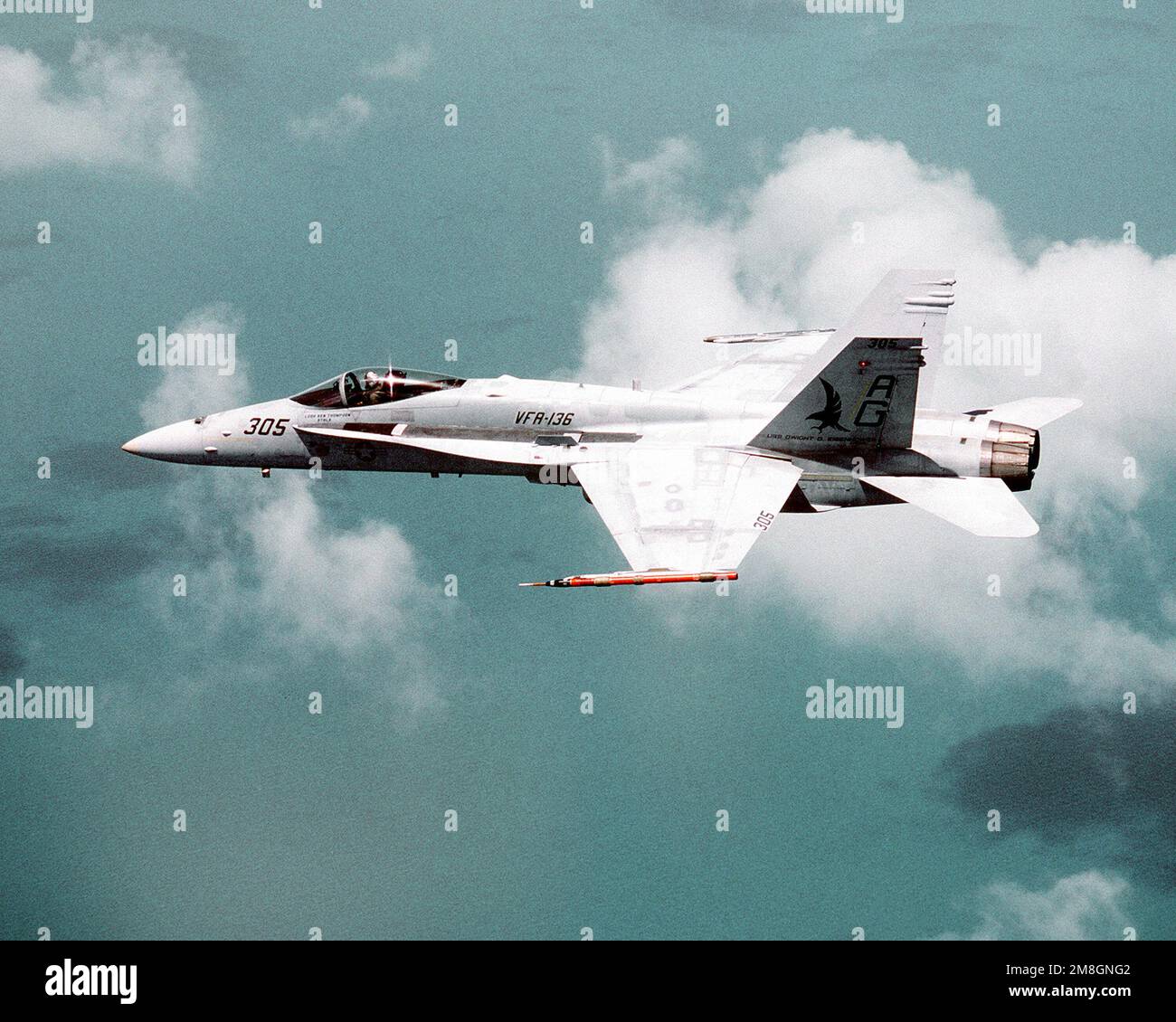 An air-to-air, left side view of a Strike Fighter Squadron 136 (VFA-136 ...