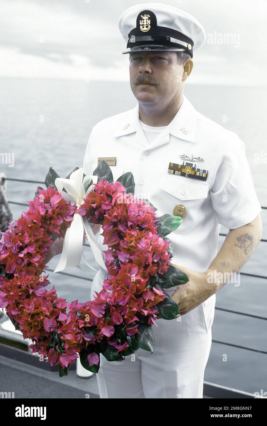 MCPO Charles Cartwright prepares to commit a wreath to the sea in ...